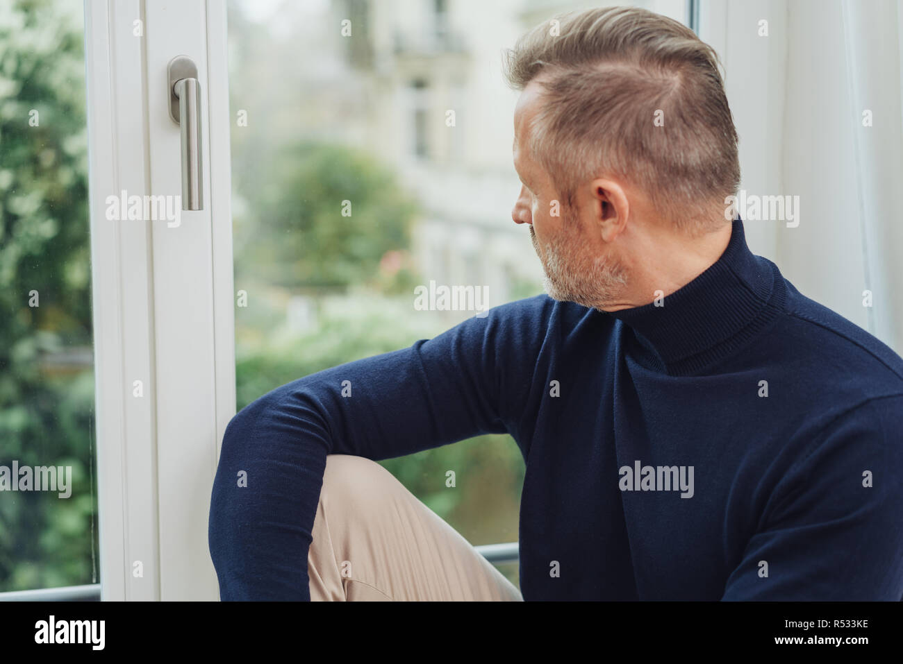 Man in window view from behind hi-res stock photography and images - Alamy