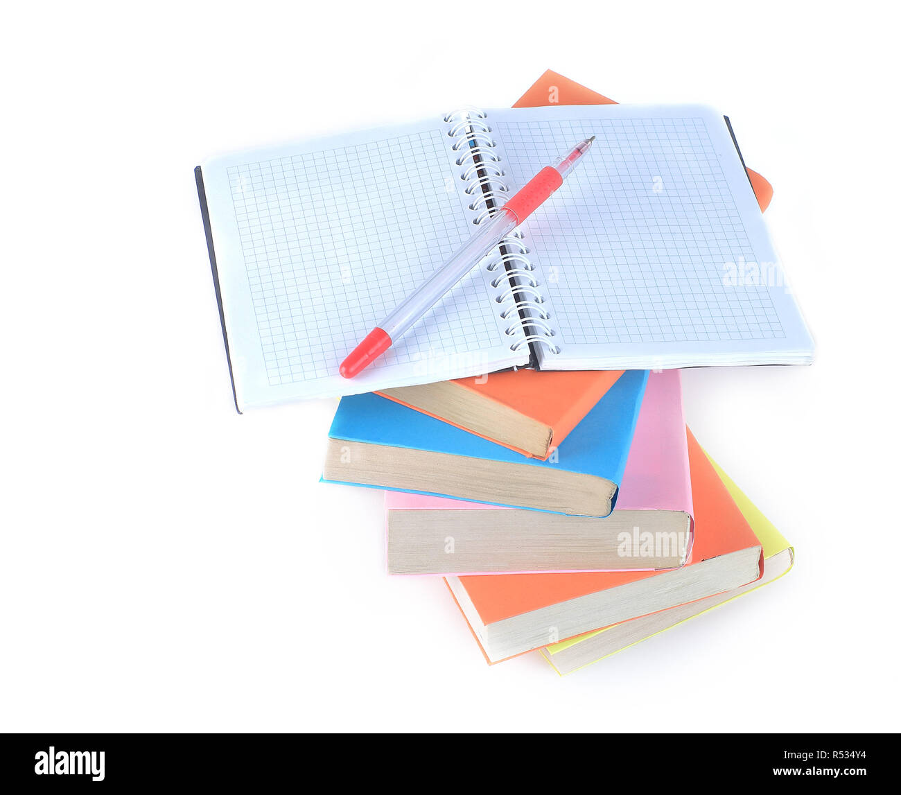 open the notebook, pen and a stack of books on white background Stock ...