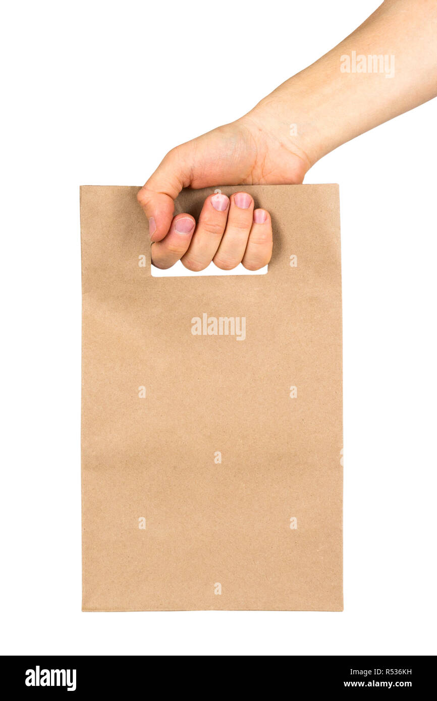 Hand holding kraft paper bag isolated on white background Stock Photo ...