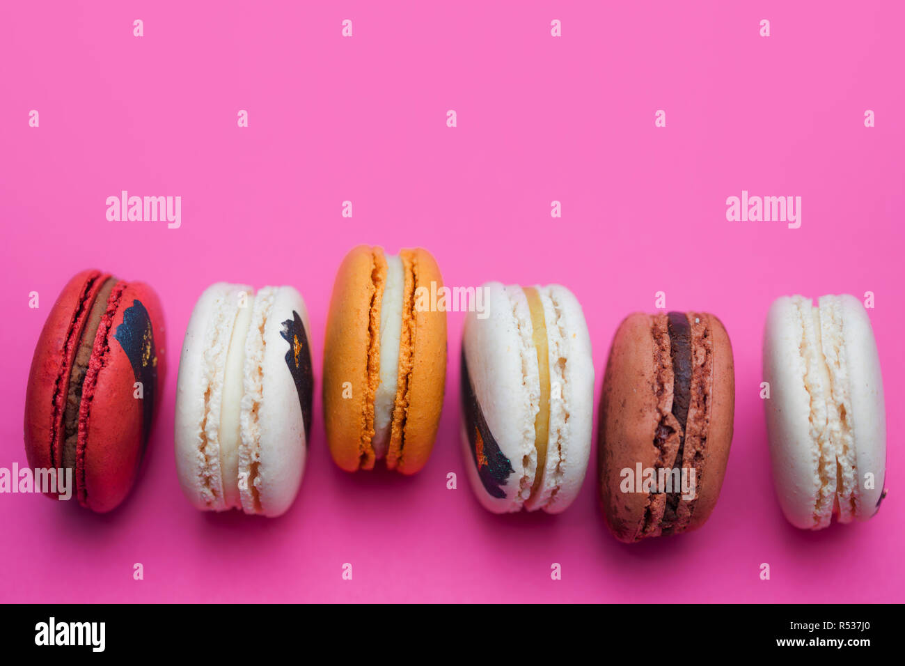 Elegant French desserts. Set of colorful macaron decorated by ...