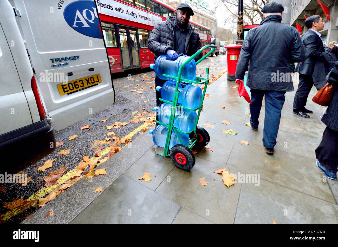 Man delivering water for water coolers and parked on a double yellow ...