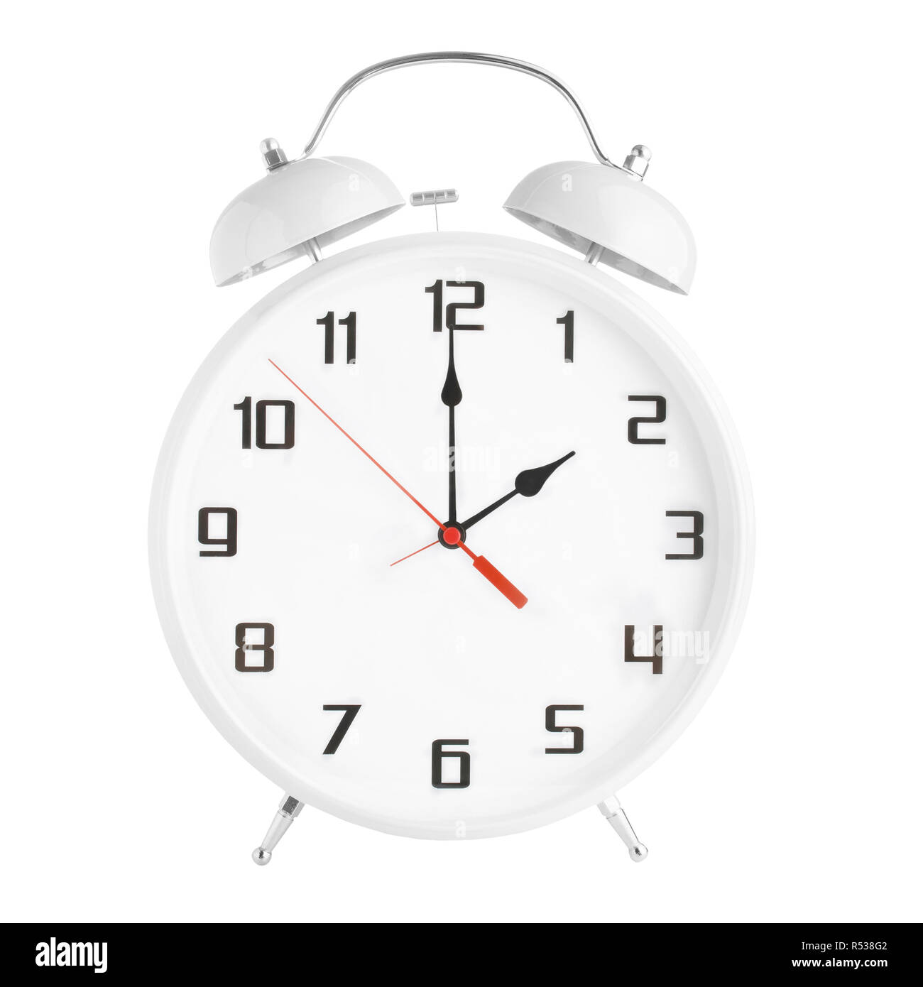 White alarm clock showing two o'clock isolated on white background ...