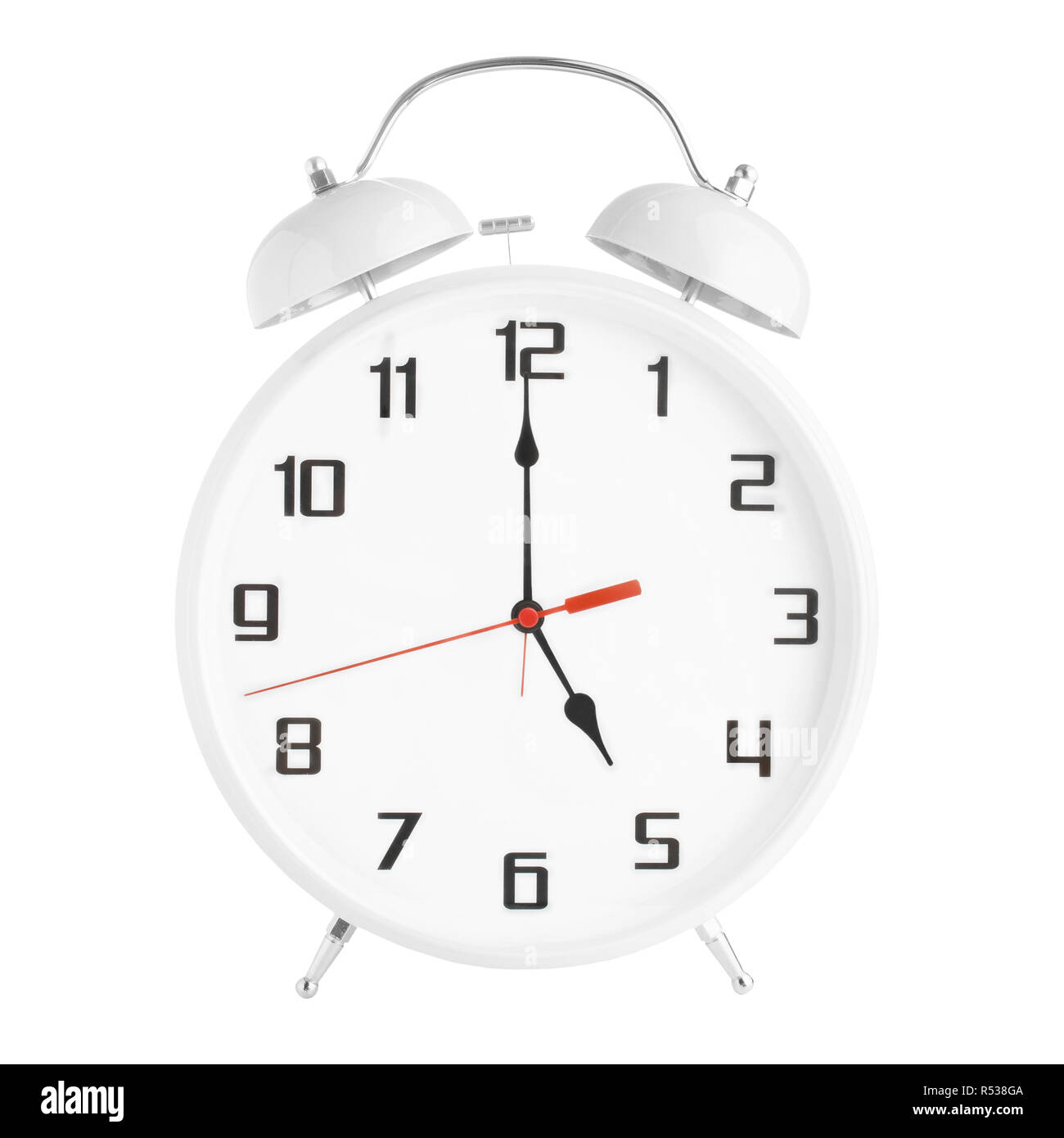 White alarm clock showing five o'clock isolated on white background ...