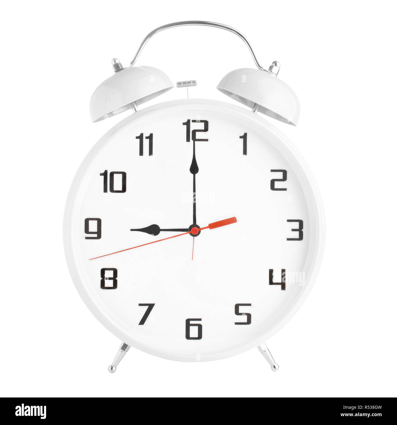 White alarm clock showing nine o'clock Stock Photo - Alamy