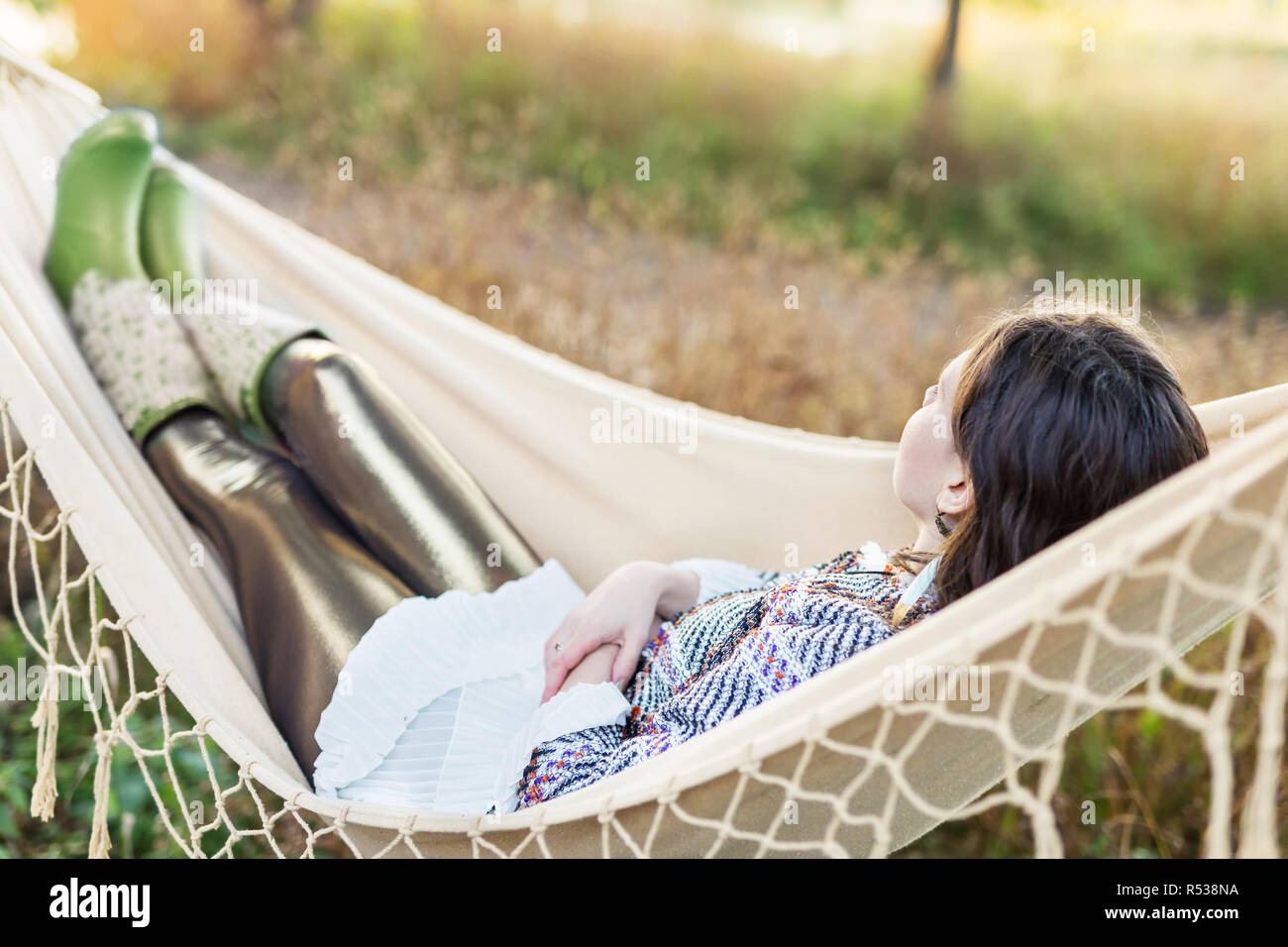Cute girl in colorful hammock Stock Photo - Alamy