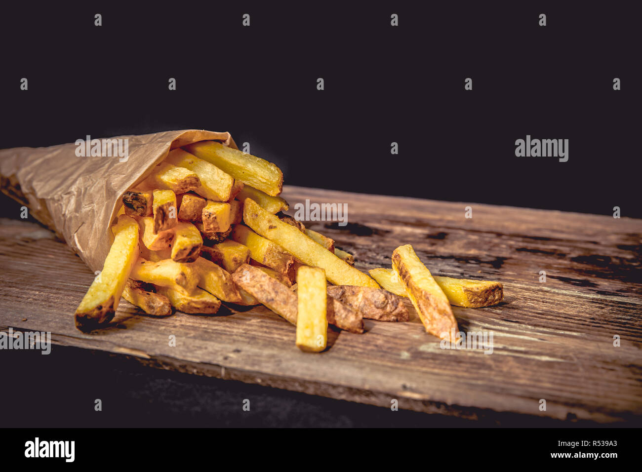 French fries Pommes Frites on Wood Dark Stock Photo - Alamy