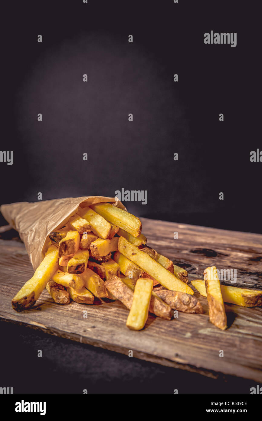 French fries Pommes Frites on Wood Dark Stock Photo - Alamy