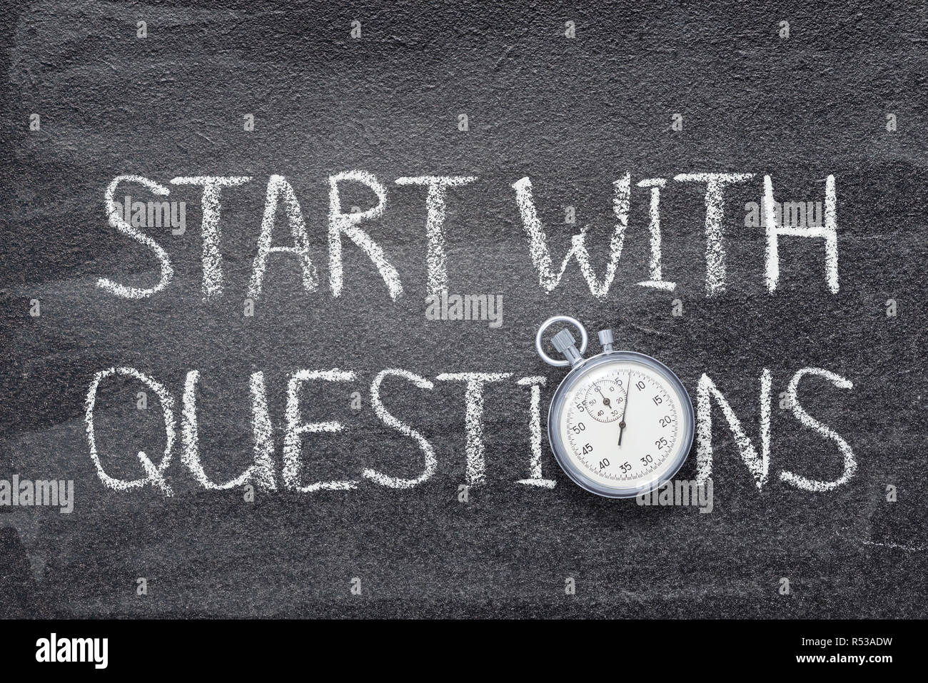 start with questions phrase written on chalkboard with vintage ...