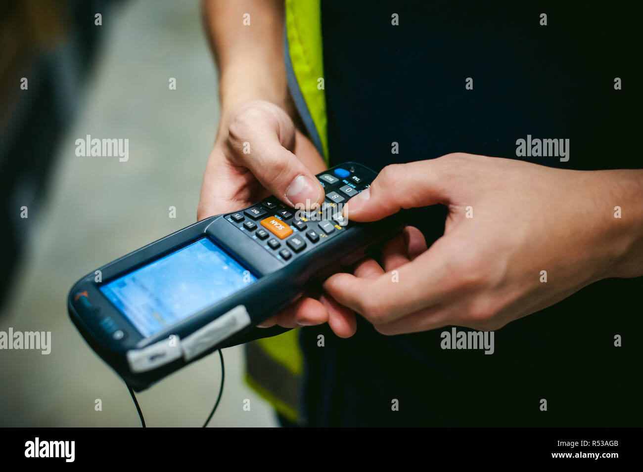 Worker Checking and Scanning Package by tablet handheld In Warehouse ...
