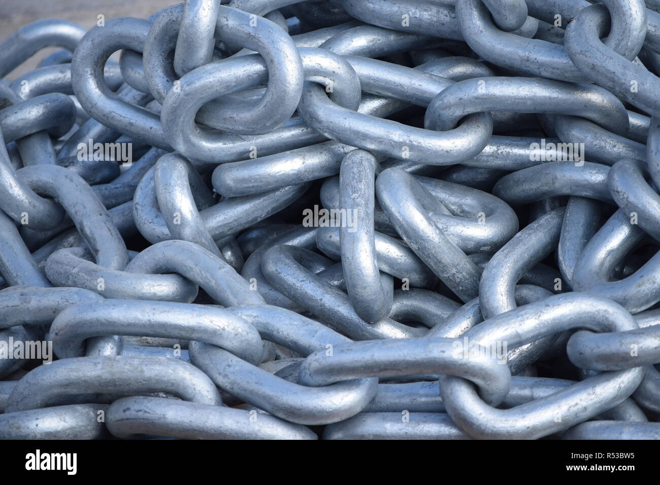 heavy iron chains at the harbor in close-up Stock Photo - Alamy