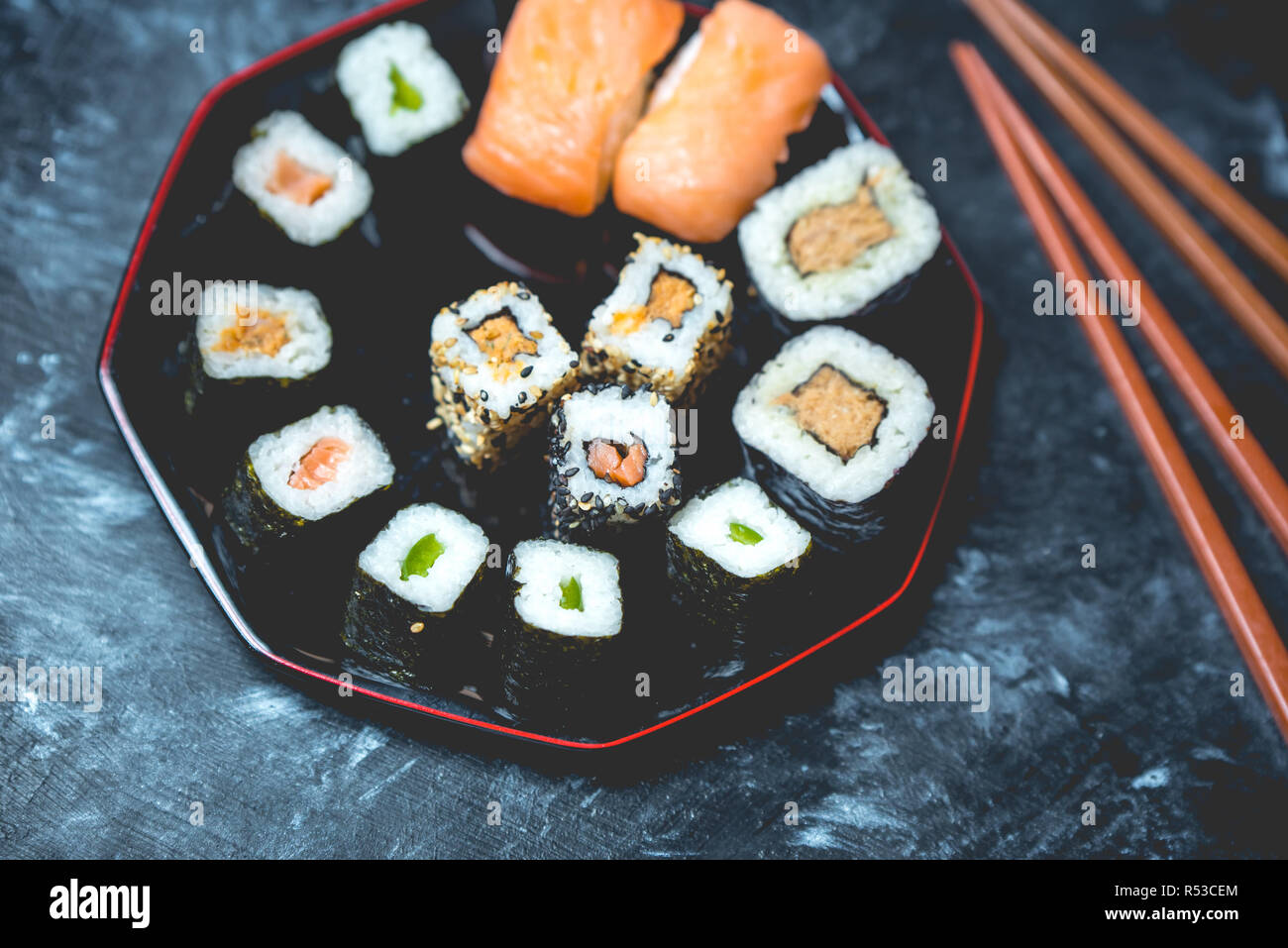 Japanese cuisine - sushi on a dark, stone background Stock Photo - Alamy