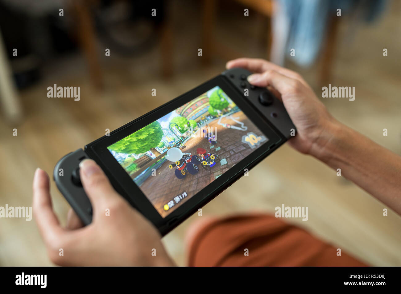 Hong Kong, 16 May 2017 -:Woman playing Nintendo Switch at home Stock ...