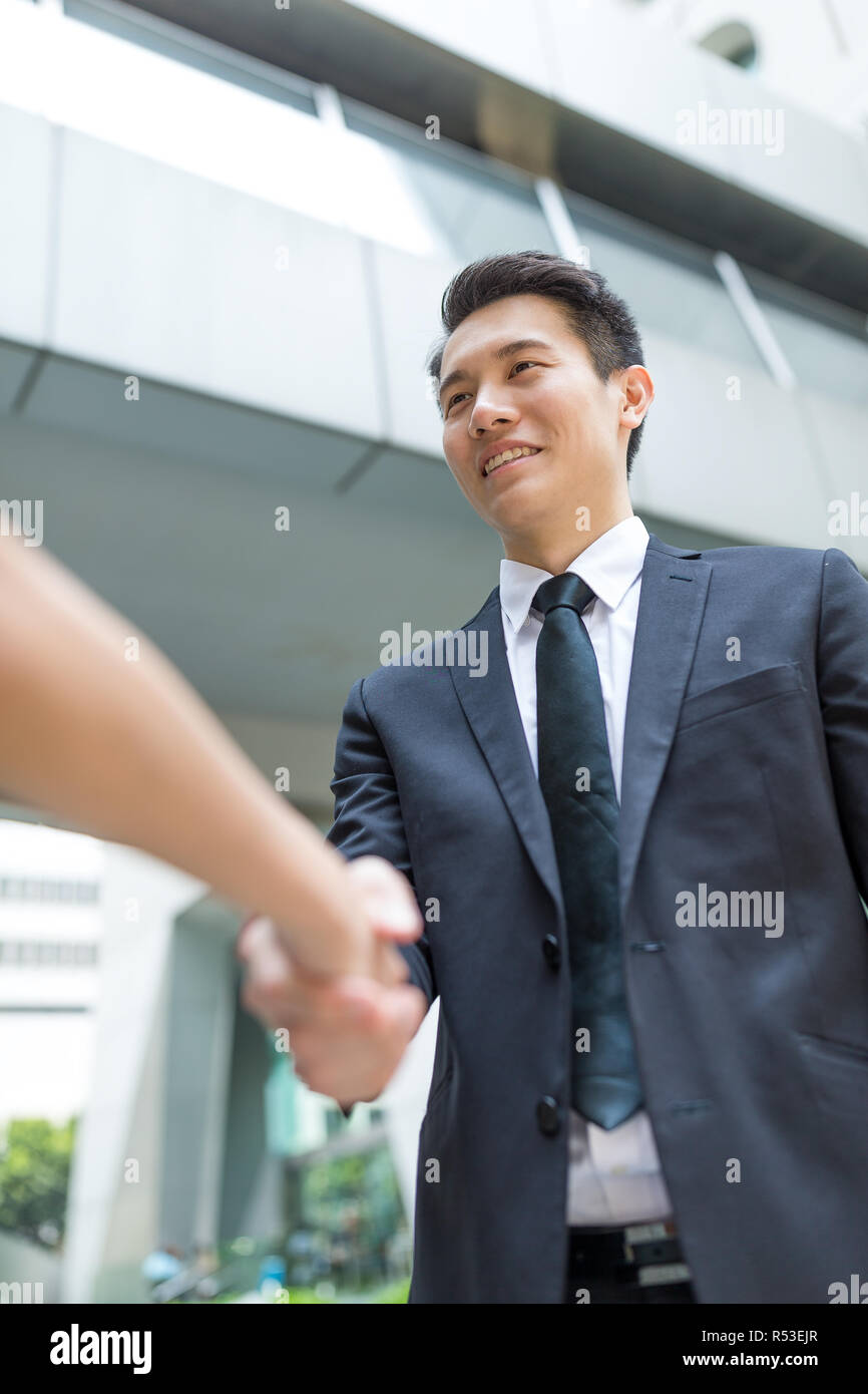 Business shake hand with partner Stock Photo - Alamy