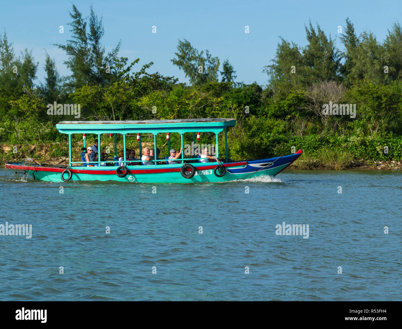 Vietnamese sampan taking tourists on cruise along Thu Bon River Hoi An ...