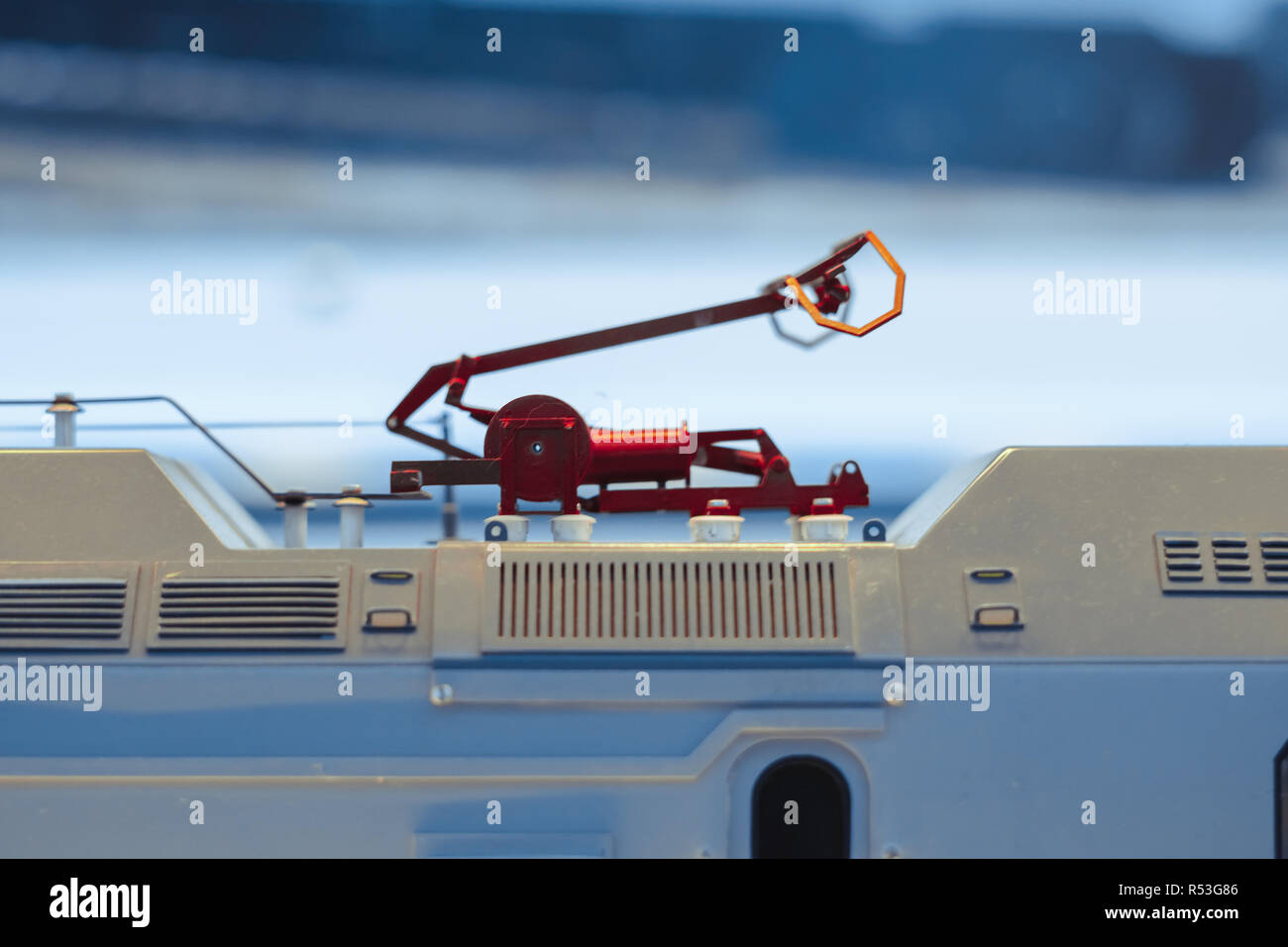 Miniature toy model of modern train crossing bridge Stock Photo - Alamy