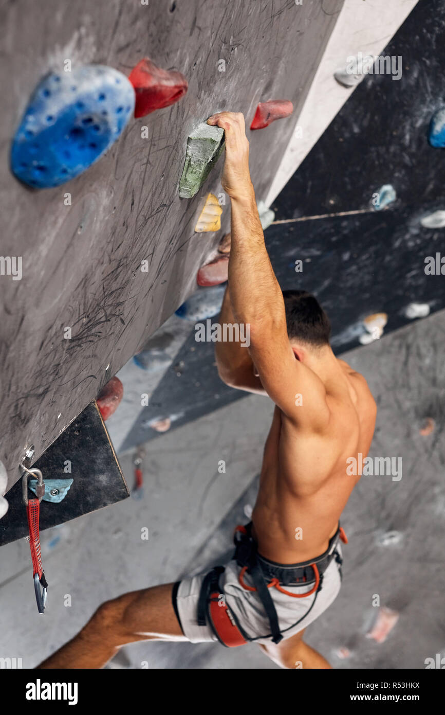 Male professional climber at indoor workout at bouldering centre Stock ...