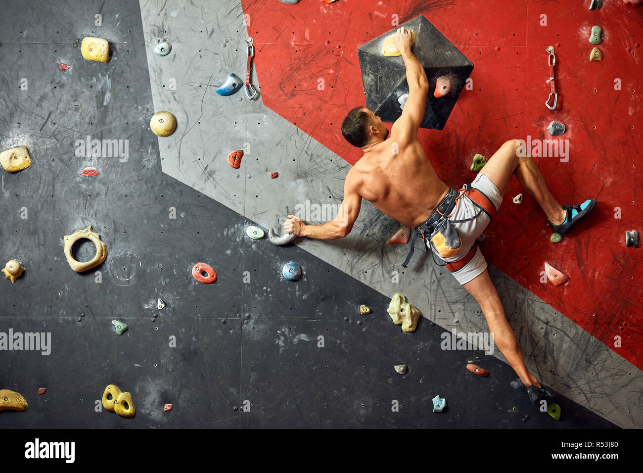 Male professional climber at indoor workout at bouldering centre Stock ...