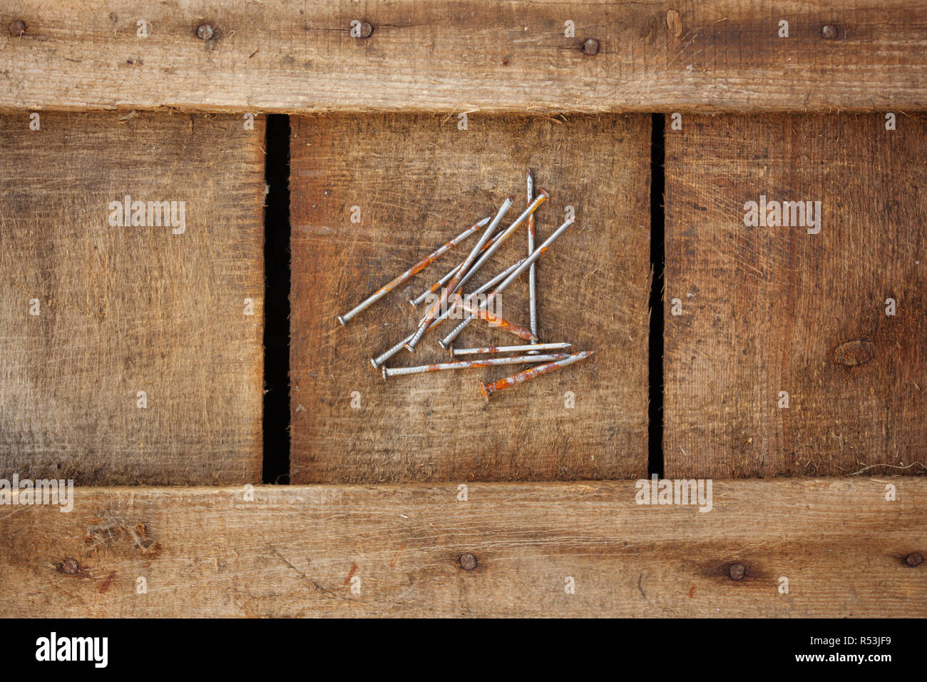 Rusty nails on dark wood texture background surface with old natural ...