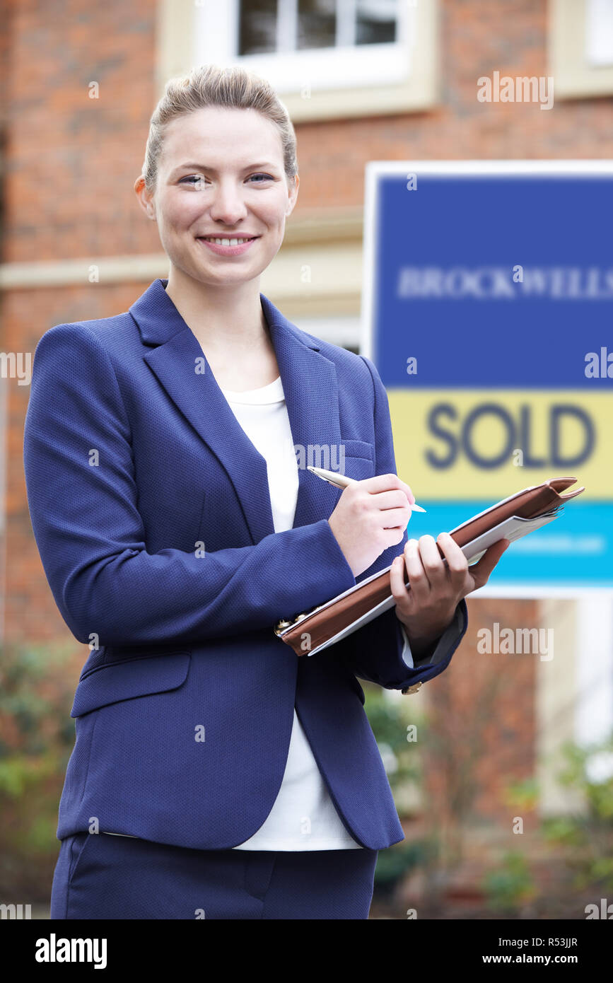 Attractive female real estate agent hi-res stock photography and images ...