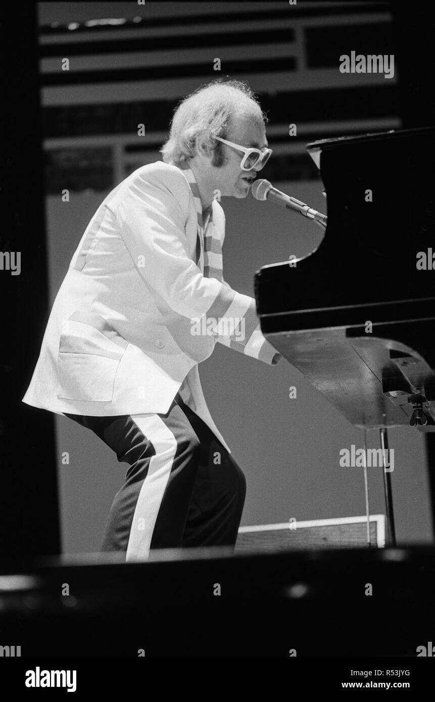 Elton John performing on stage, during the Elton John and Ray Cooper ...