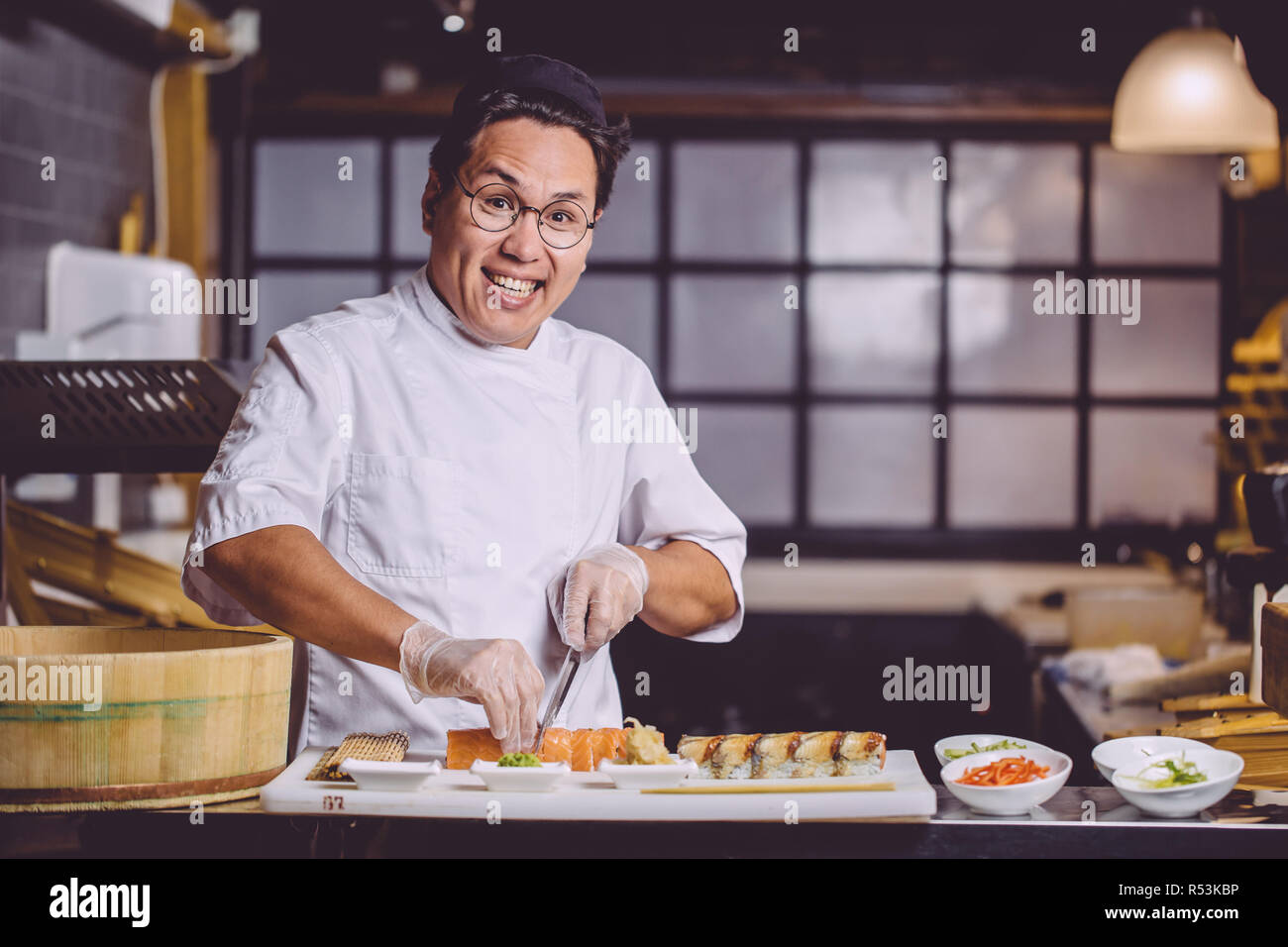 joyful Asian man working in the sushi restaurant Stock Photo - Alamy