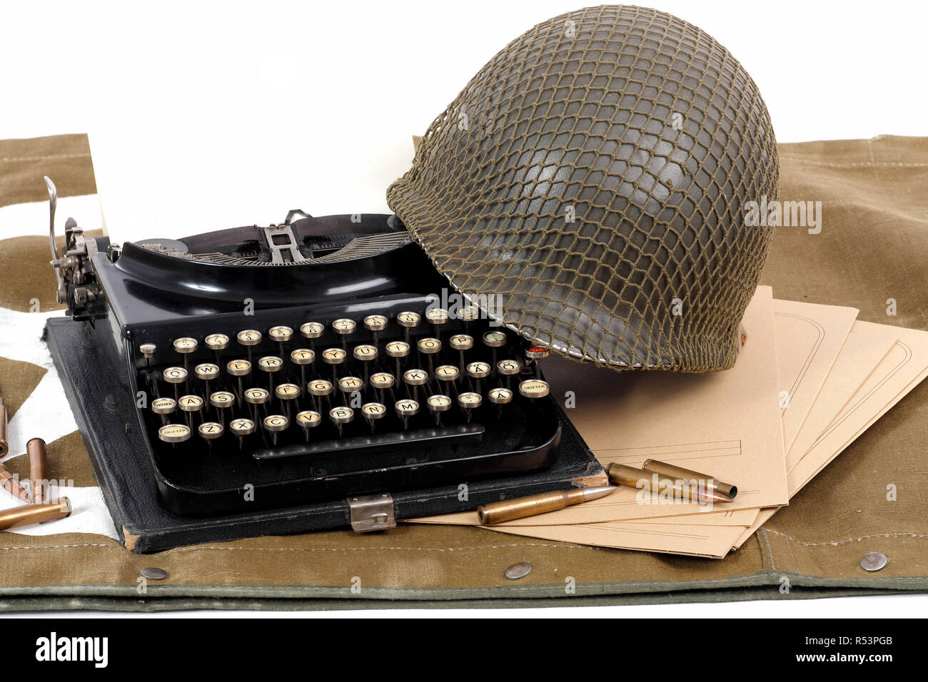 US military helmet of the Second World War with old typewriter Stock ...