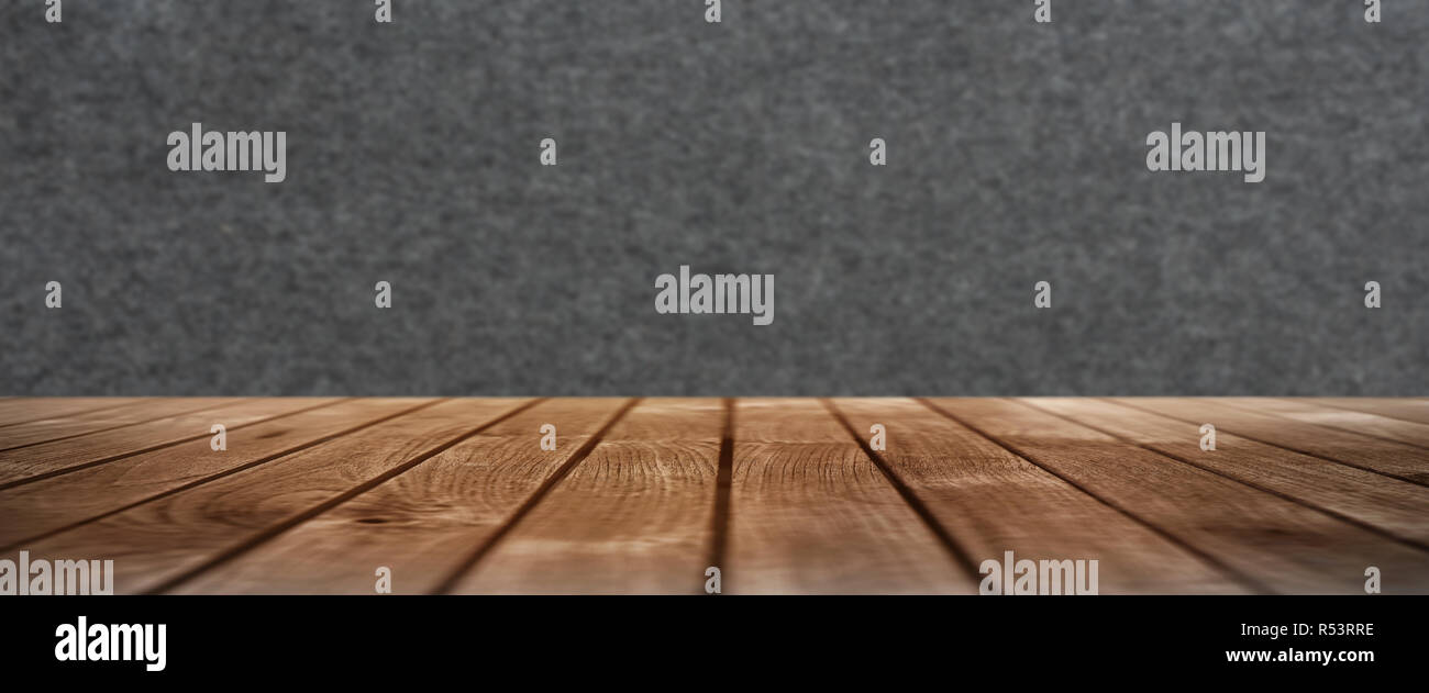 wooden table with a felt wall Stock Photo - Alamy