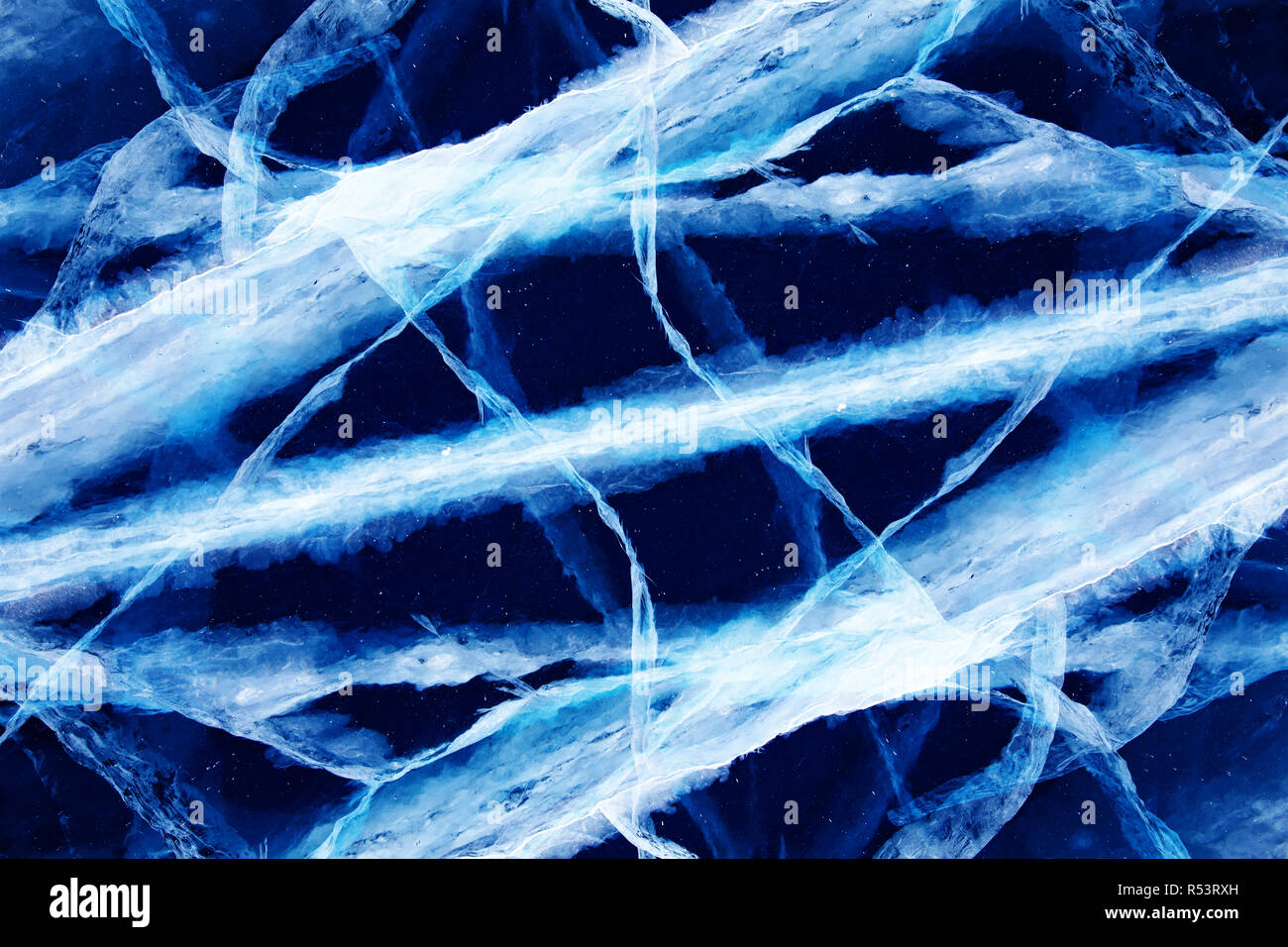 frozen clear ice of Baikal lake with many cracks Stock Photo - Alamy