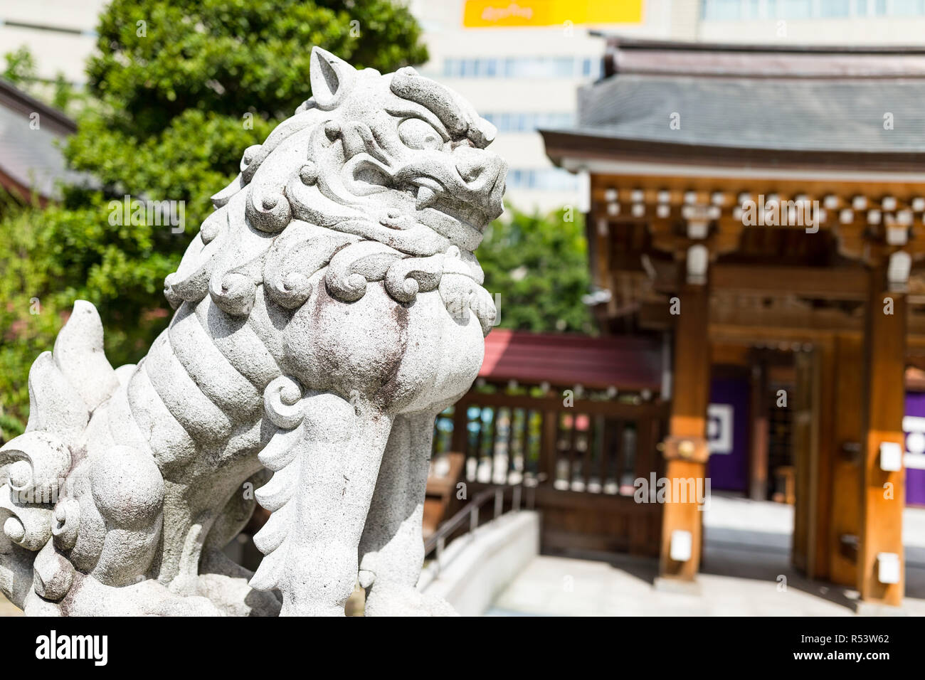 Japanese temple and lion statue Stock Photo - Alamy
