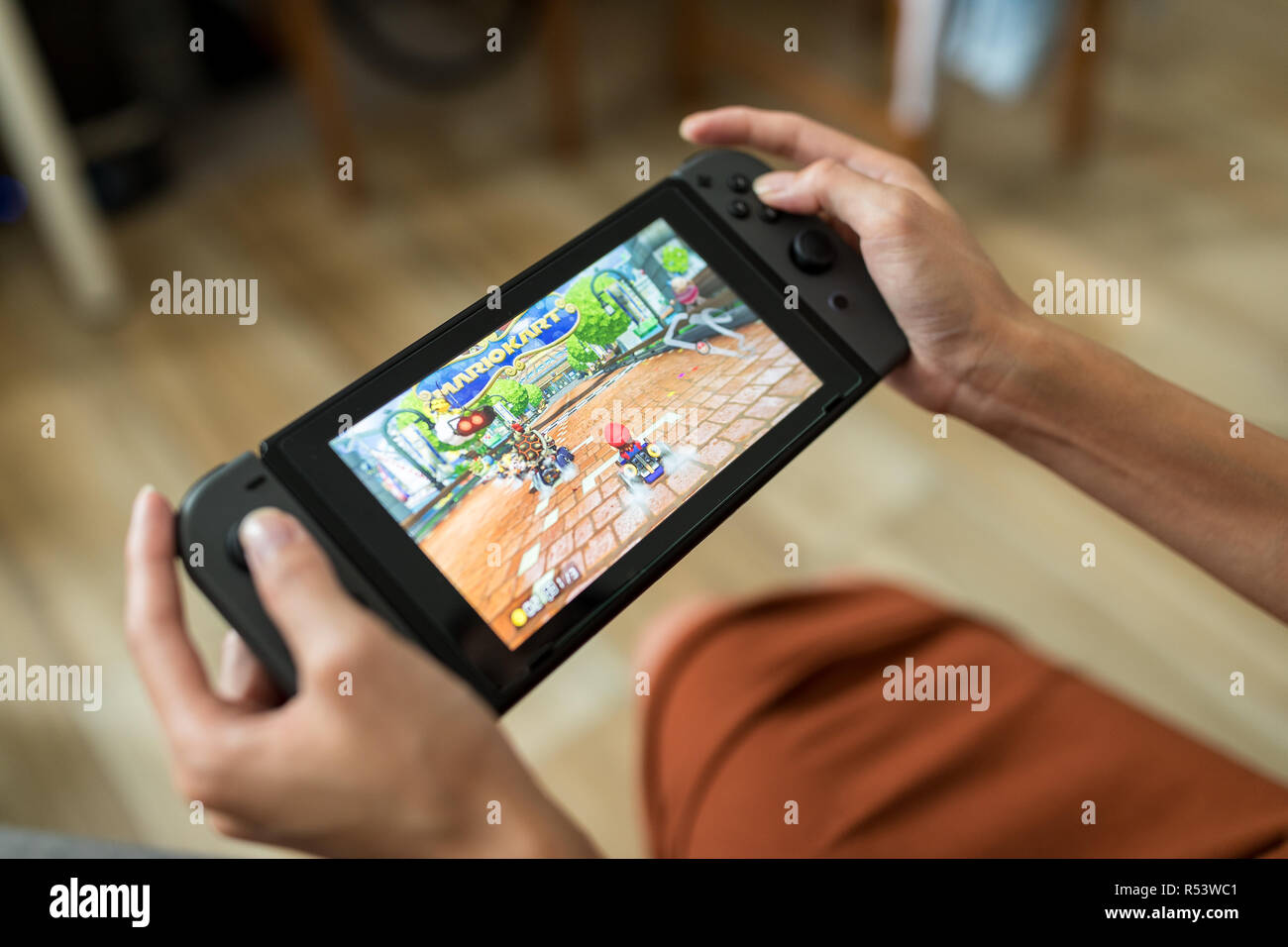 Hong Kong, 16 May 2017 -:Woman playing game on Nintendo Switch console ...