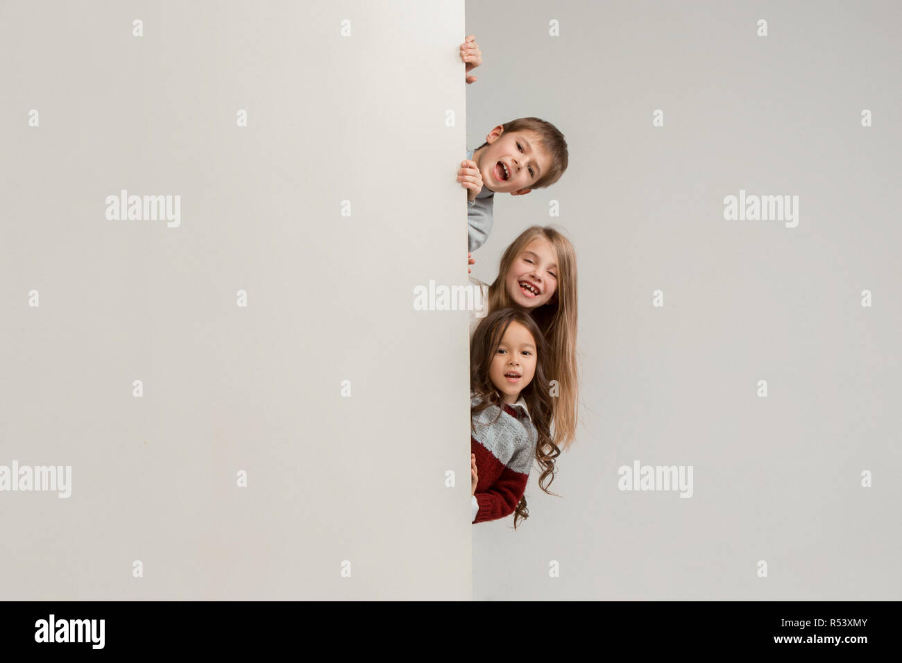 Banner with a surprised children peeking at the edge with copyspace ...