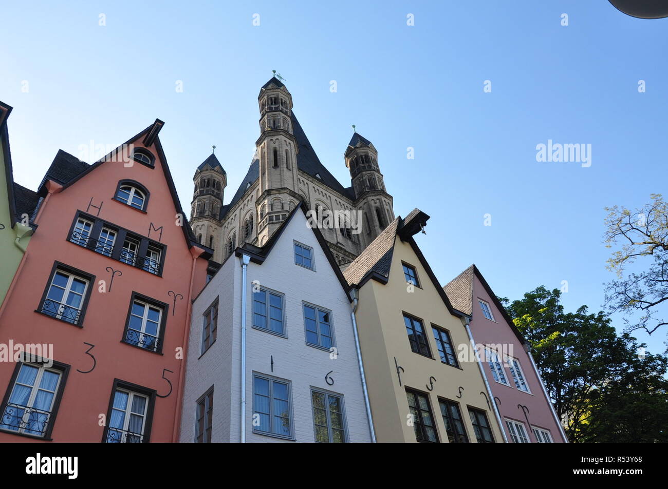 germany,cologne - colorful facades of houses in the old town with st ...