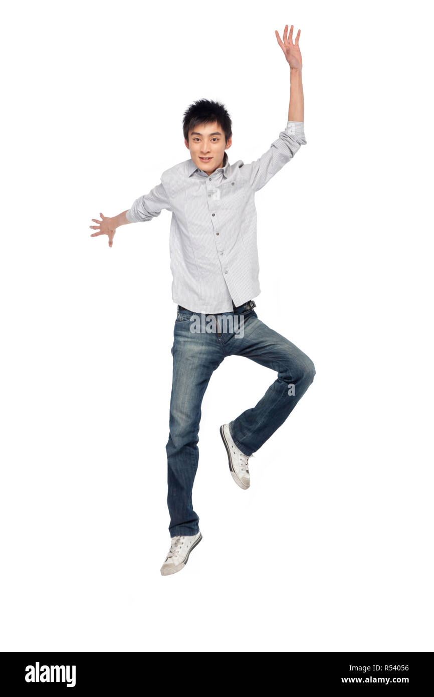 Portrait of a young man mid-air Stock Photo - Alamy