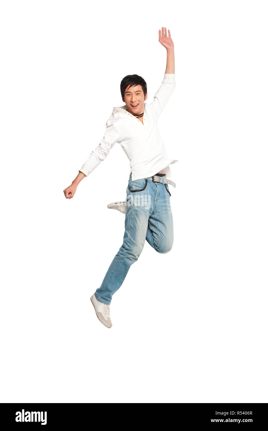 Portrait of a young man mid-air Stock Photo - Alamy