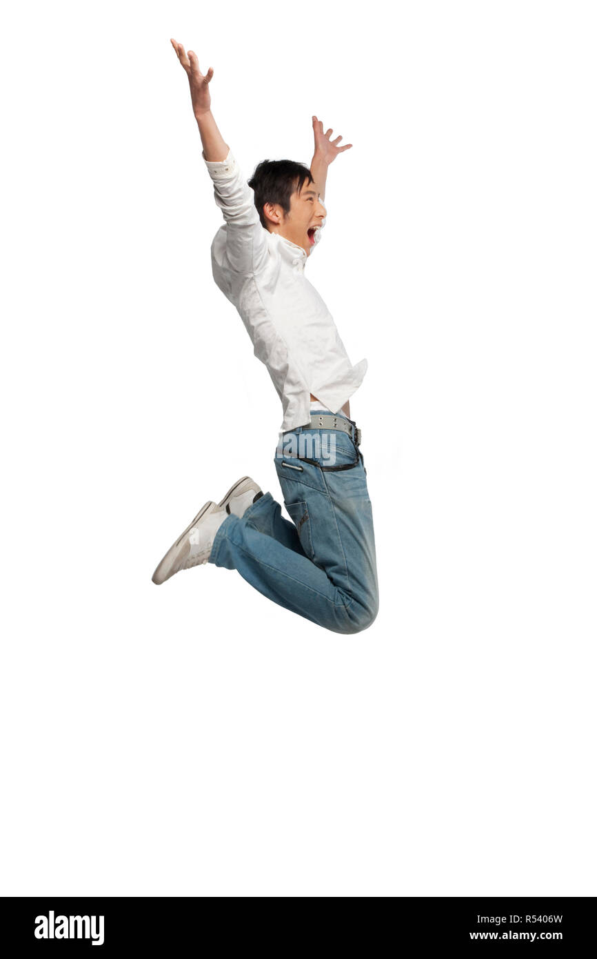 Portrait of a young man mid-air Stock Photo - Alamy