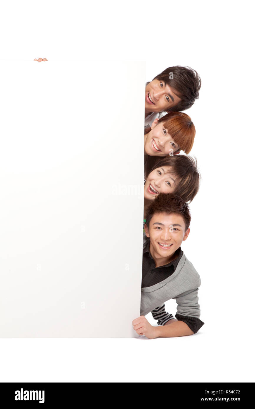 A group of young people holding a blank sign Stock Photo - Alamy