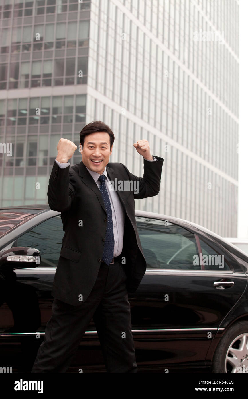Businessman expressing enthusiasm Stock Photo - Alamy