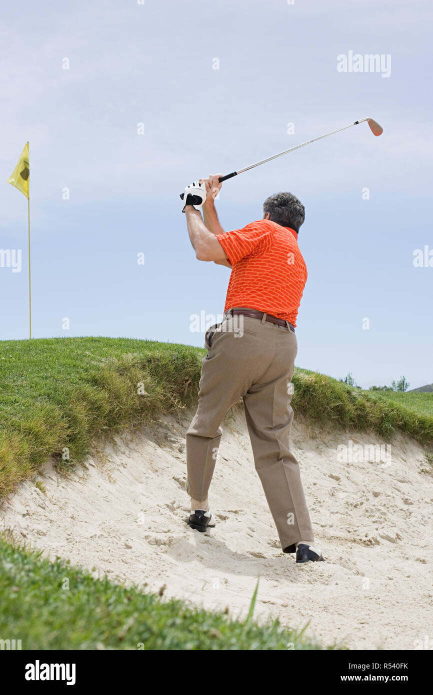 Man playing golf Stock Photo - Alamy