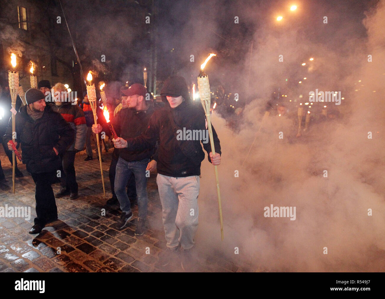 Kiev, Ukraine. 29th Nov, 2018. Protesters seen holding torches and a ...