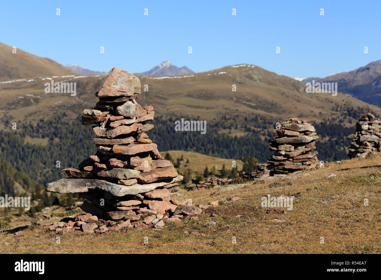 stone men at the mountain summit Stock Photo - Alamy