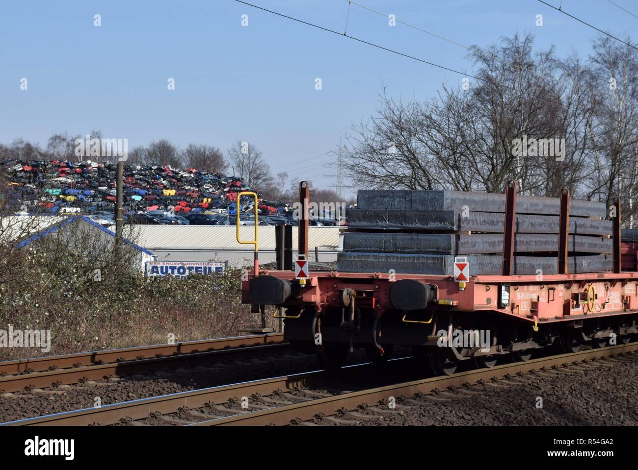 Steel slabs on a freight train and junk cars on 01.03.2018 in Bottrop ...