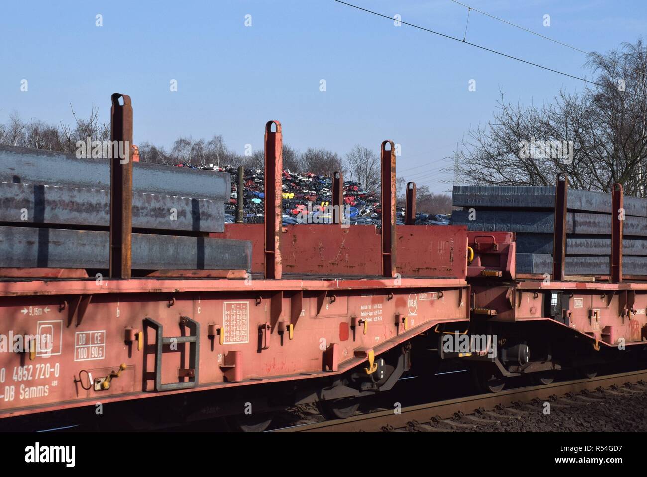 Steel slabs on a freight train and junk cars on 01.03.2018 in Bottrop ...