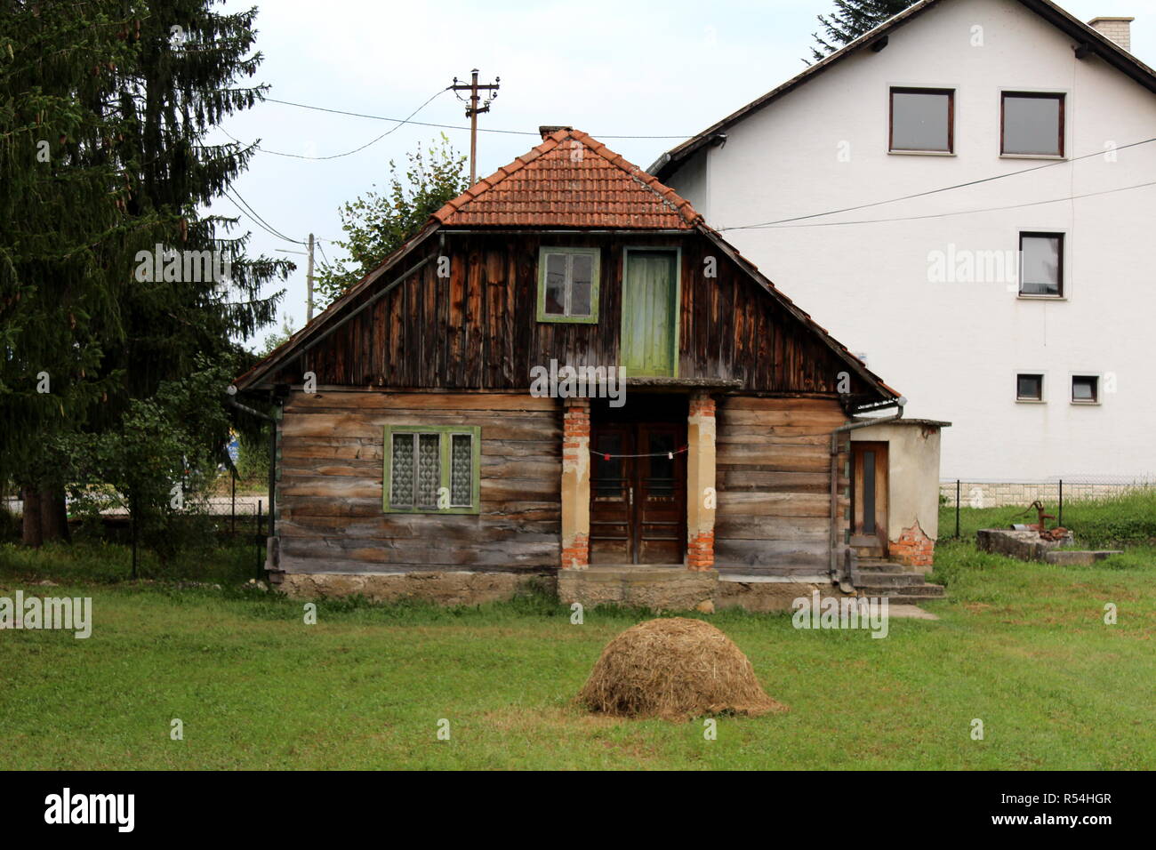 Very old small wooden family house with dilapidated boards, doors and ...