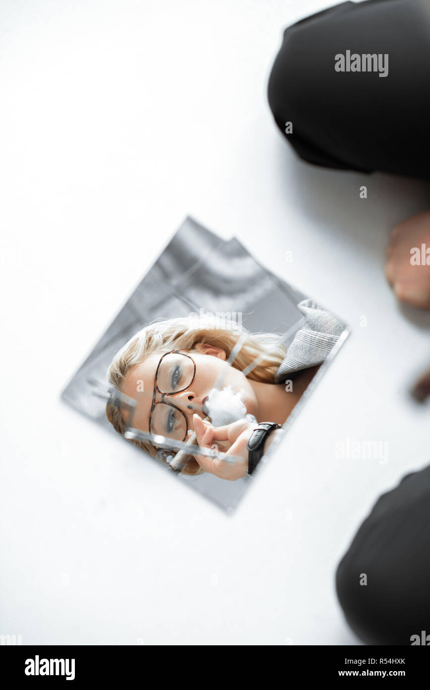 attractive stylish woman smoking cigar, reflection in mirror Stock ...