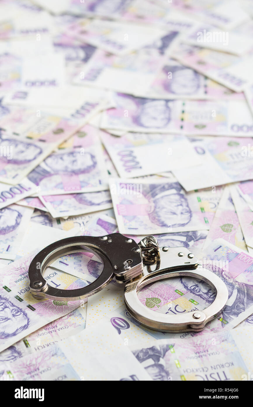 Handcuff and money Stock Photo - Alamy