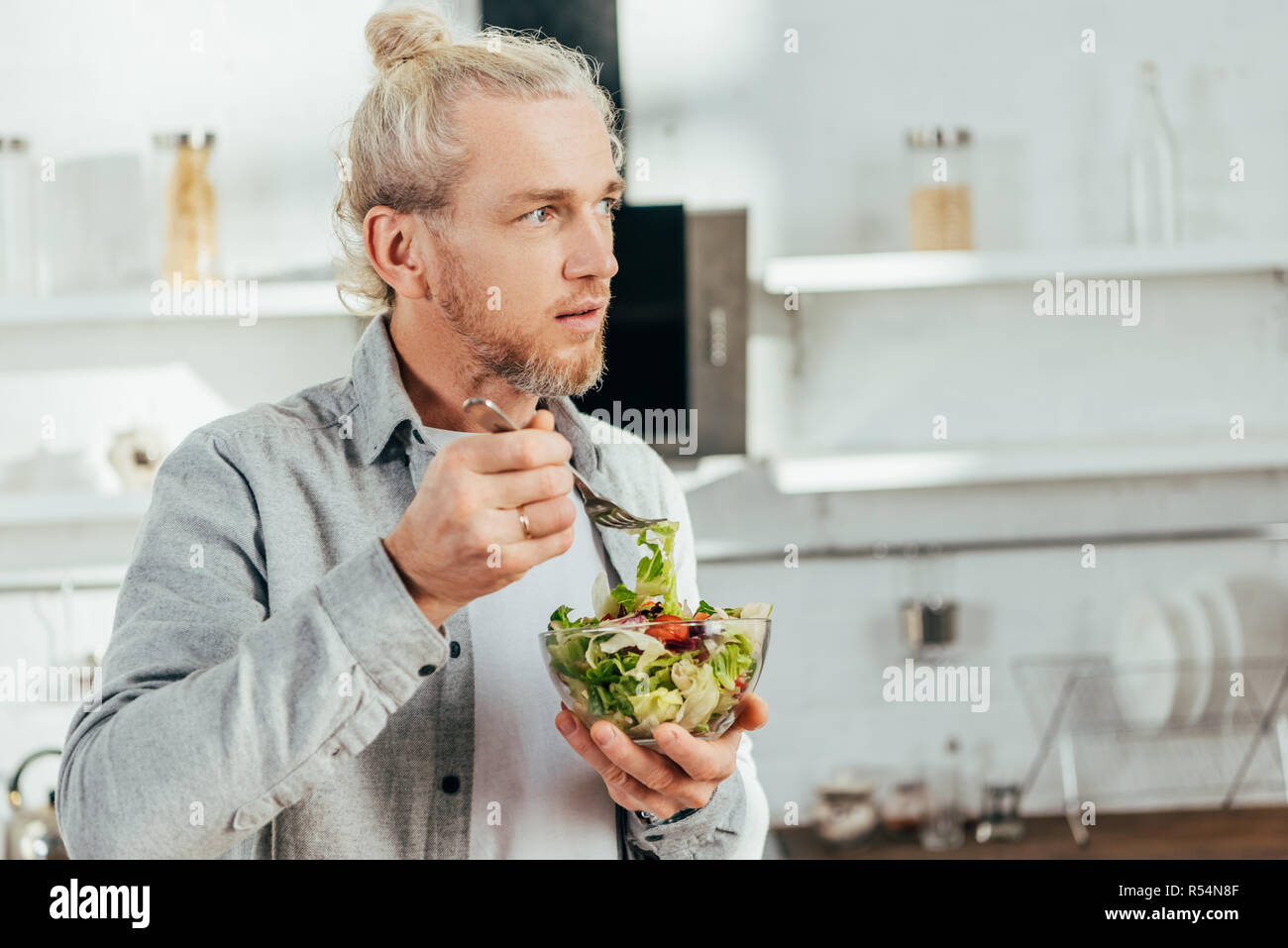 Man eating vegetable salad hi-res stock photography and images - Alamy