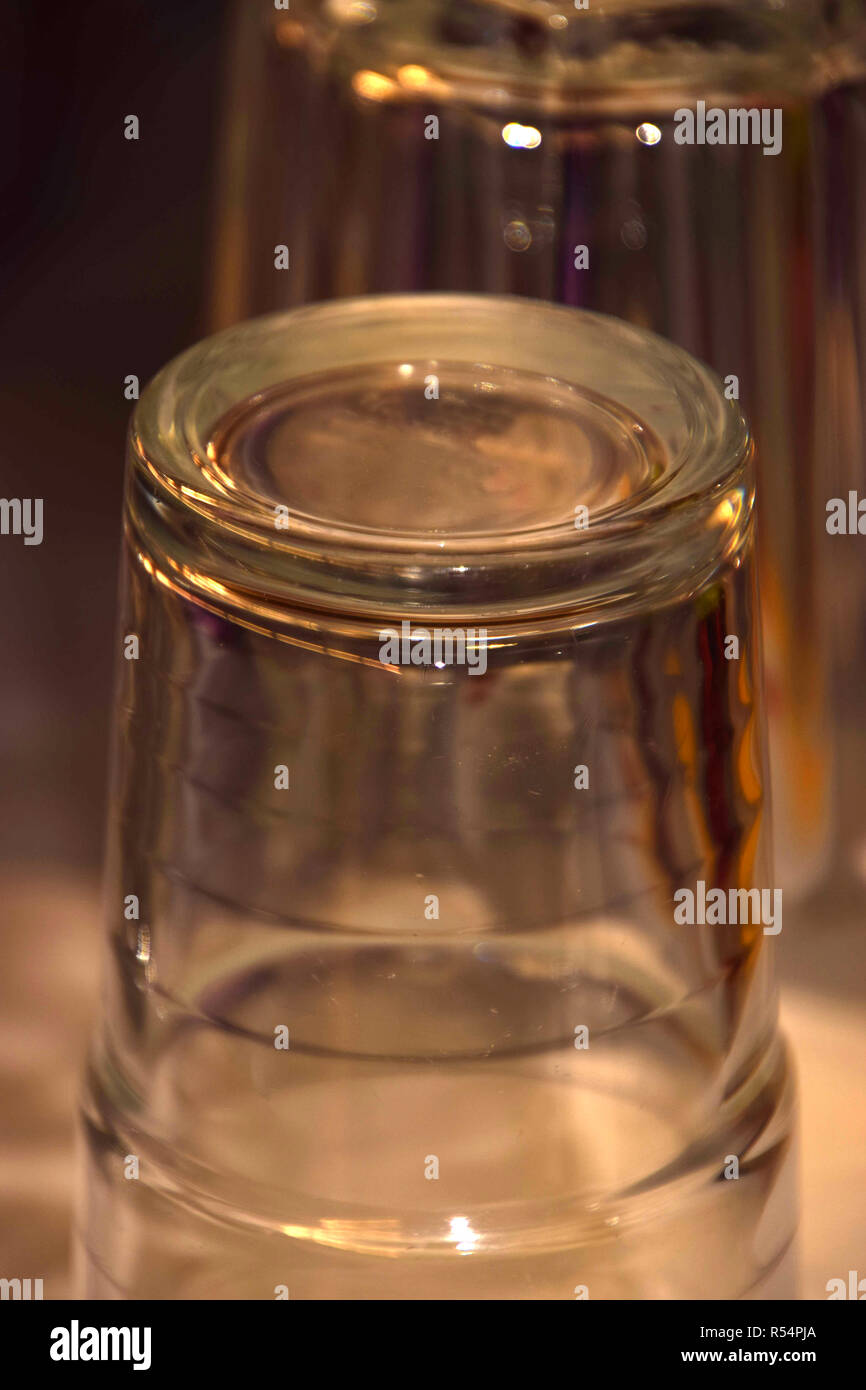 ground of an empty glass close up view, clear water glasses are upside ...