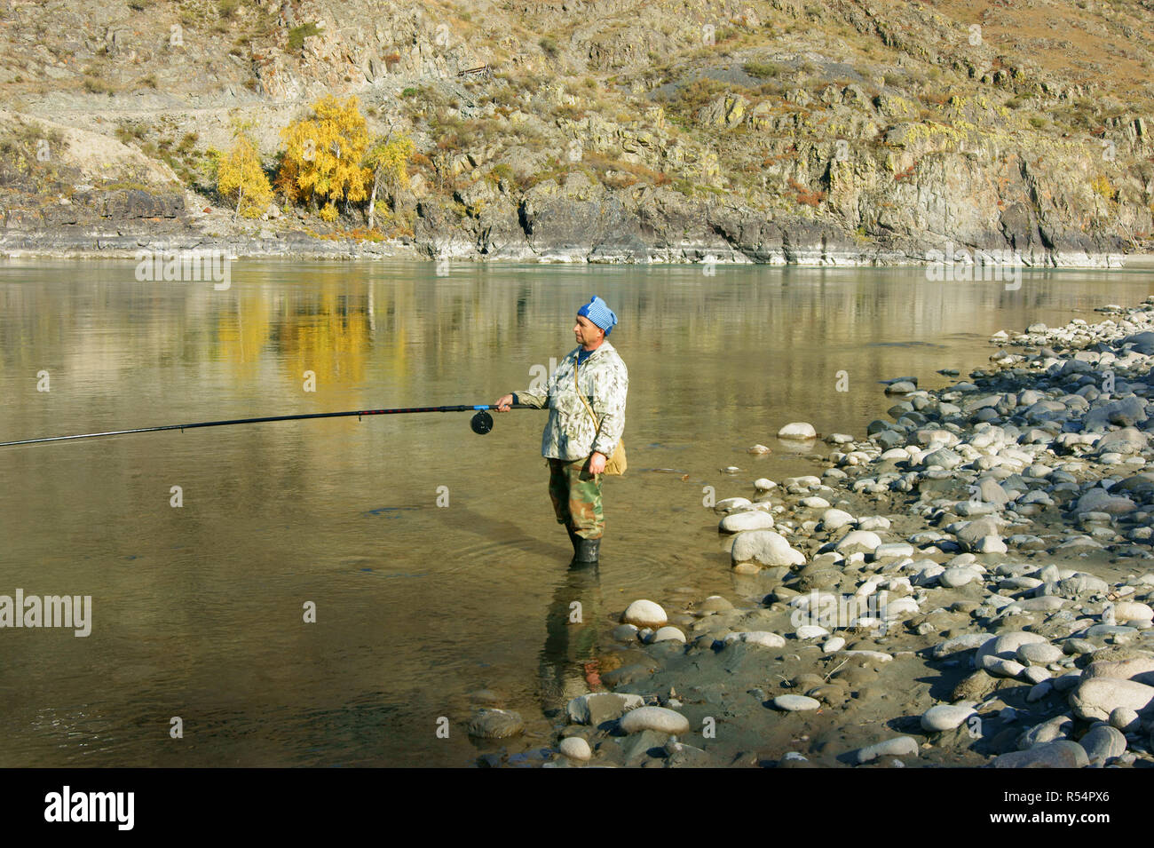Man goes fishing Stock Photo - Alamy
