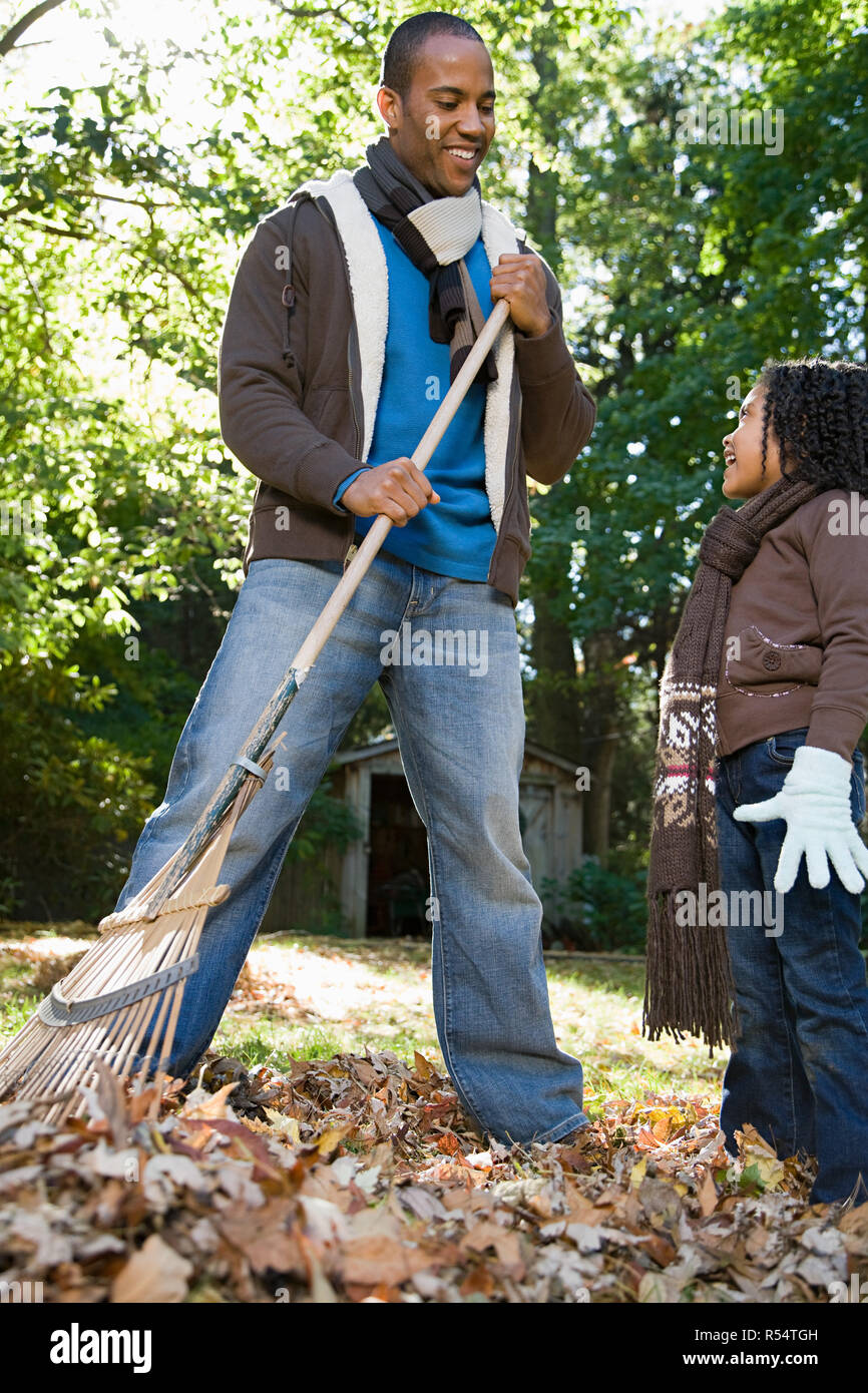 Raking leaves family hi-res stock photography and images - Alamy