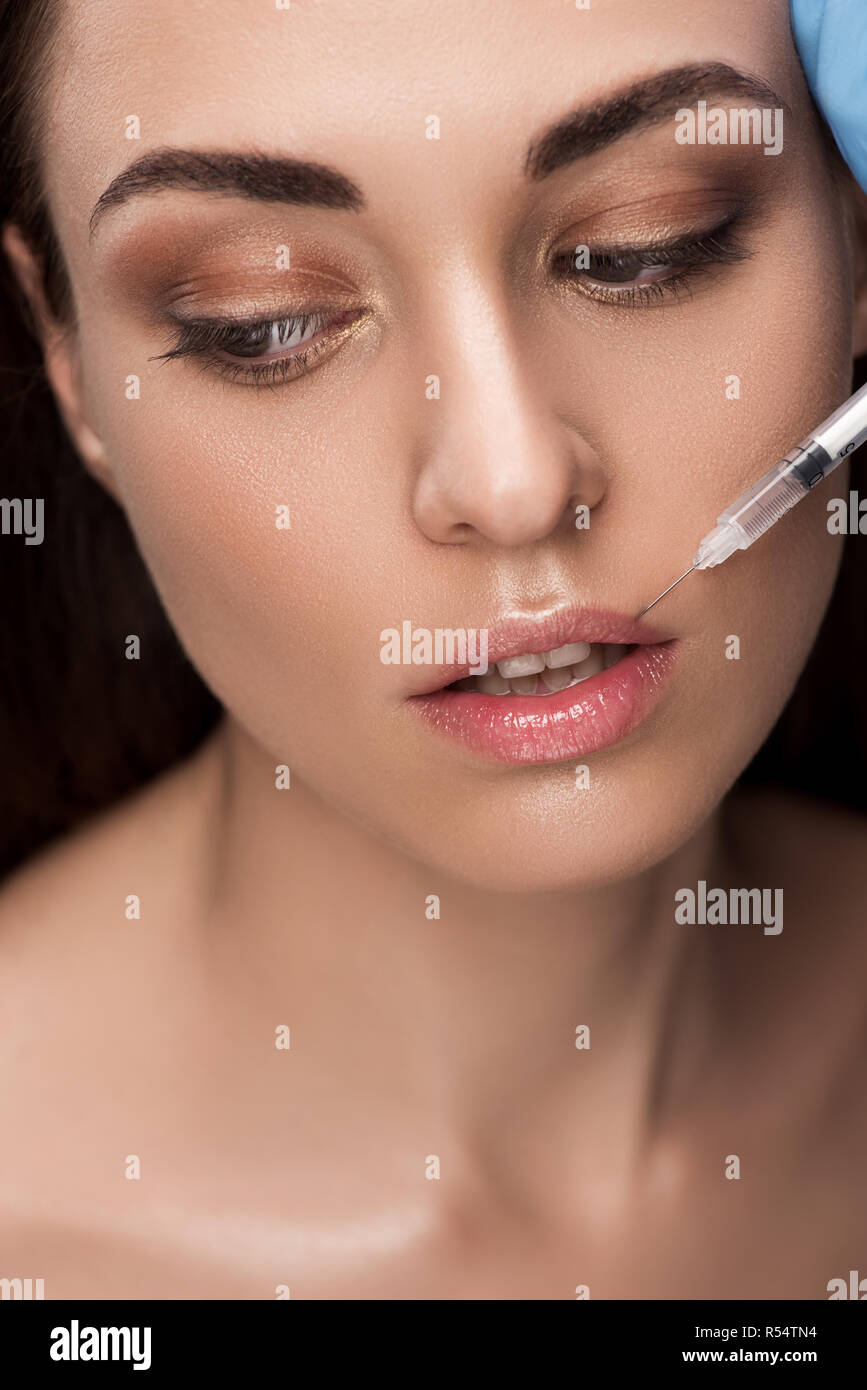 beautiful woman making beauty injection into lips Stock Photo - Alamy